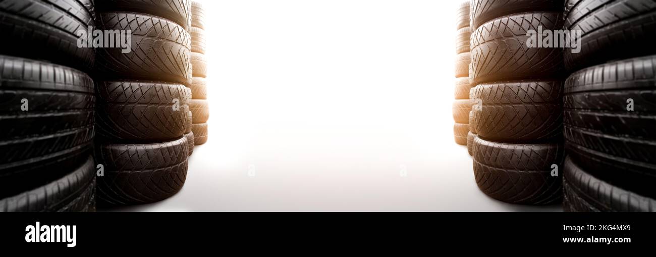 A pile of automobile tyre with center copy space on white background ...