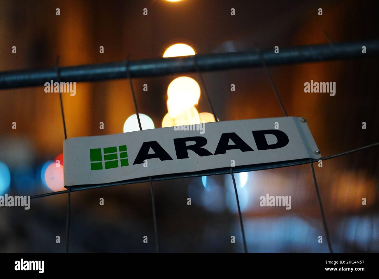 The Arad construction company board with logo on a metal fence at night Stock Photo - Alamy
