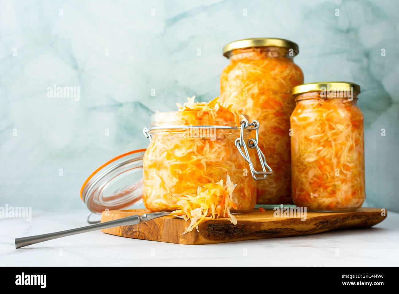 Fresh fermented vegetables, fermented cabbage with carrots in glass ...