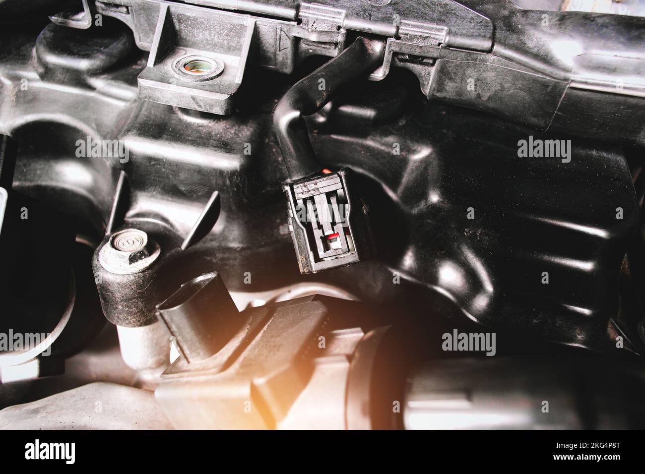 Close up of electronic plug connector of car ignition coil in the ...
