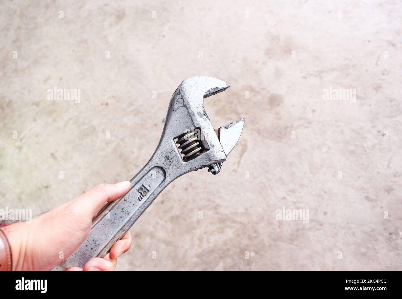 Adjustable spanner in a hand, industrial spanner isolated Stock Photo ...
