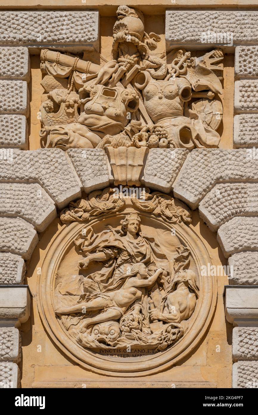 Detail of ancient bas-relief stone carving on exterior of historic Arc ...