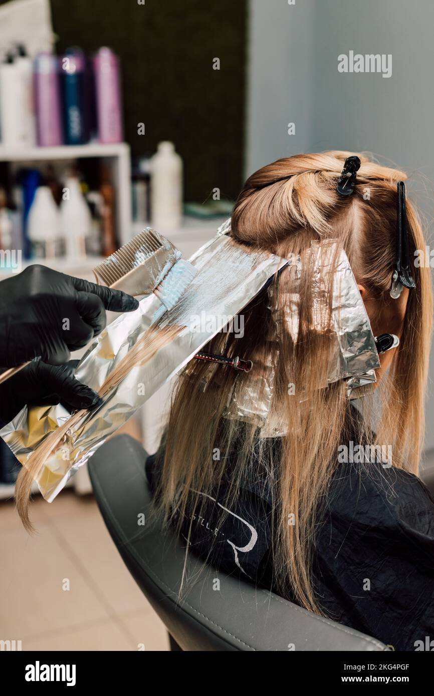 Woman applies color treatment hair hi-res stock photography and images ...