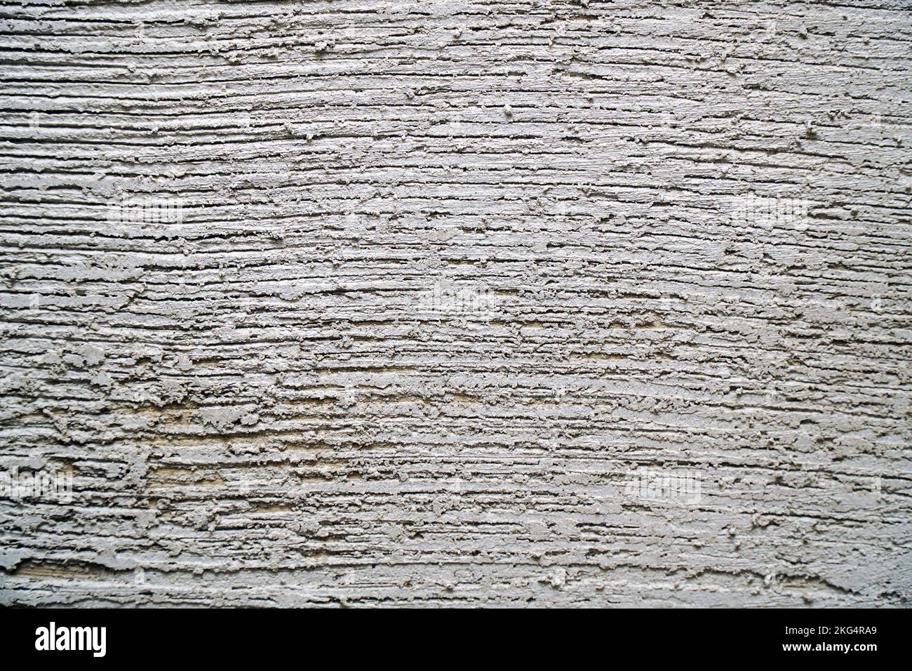 Gray decorative plaster on the wall with pressed horizontal stripes. Plaster background Stock ...