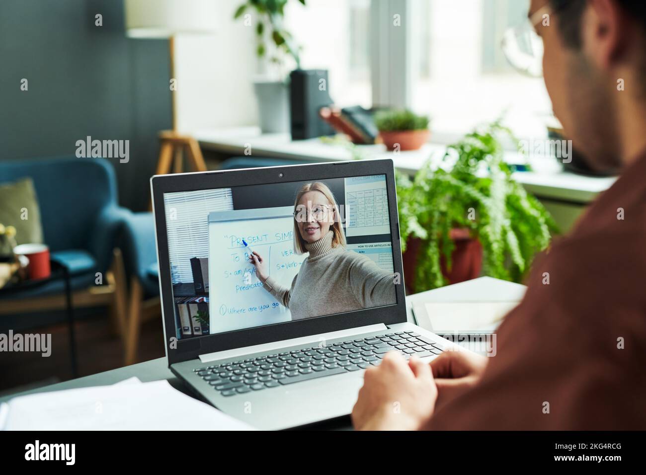 Laptop screen with mature blond confident teacher in eyeglasses ... Laptop screen with mature blond confident teacher in eyeglasses ...