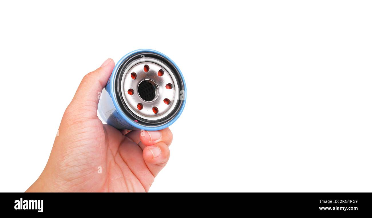 Automotive oil filter in a hand , object isolated with clipping path ...