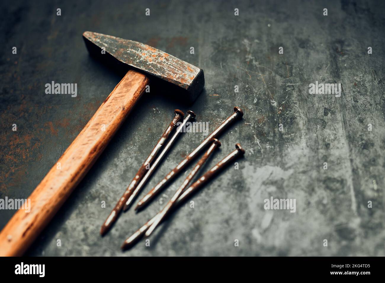 Hammer and nails on steel surface. Tools for maintenance. Hardware ...