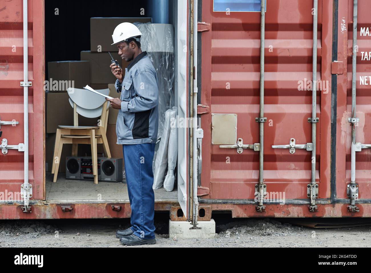 Graphic side view portrait of young male worker wearing hardhat while ...