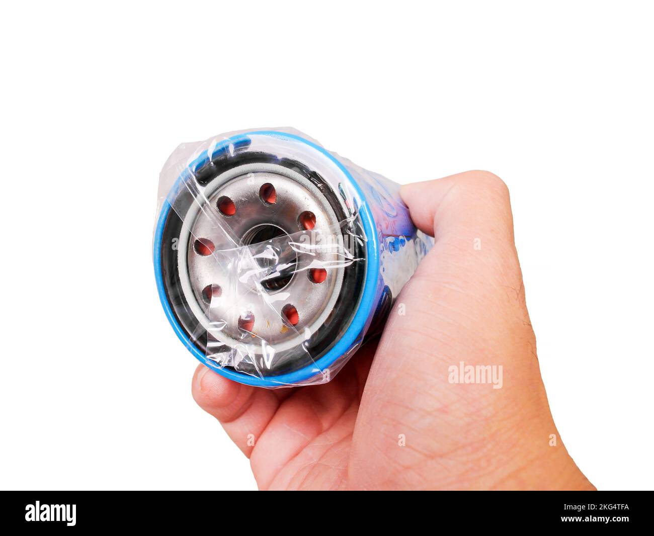 Automotive oil filter in a hand , object isolated with clipping path ...