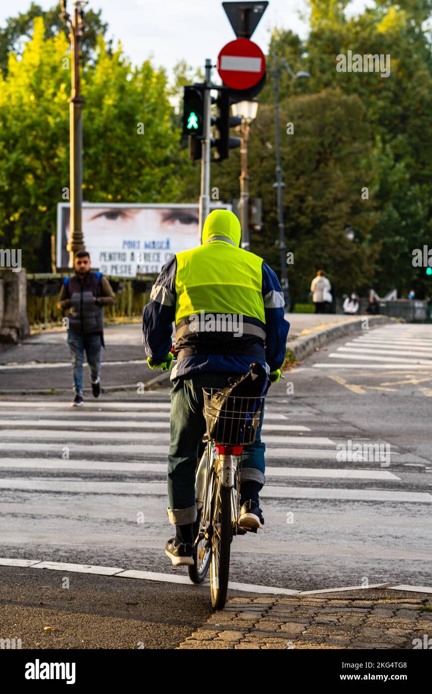 Riding a bicycle on the city streets. Commute to work in Bucharest ...