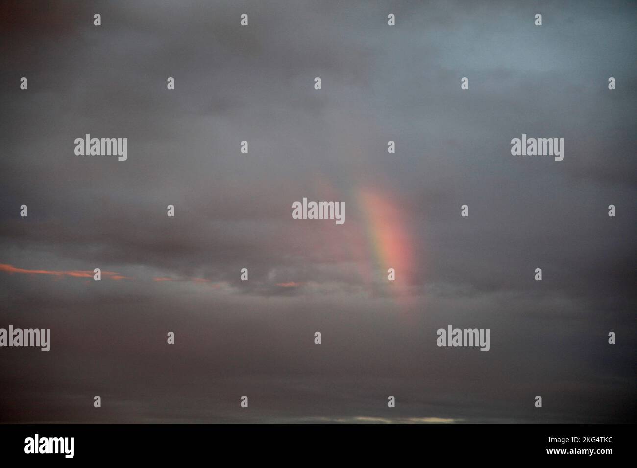 Partial rainbow and clouds Stock Photo - Alamy