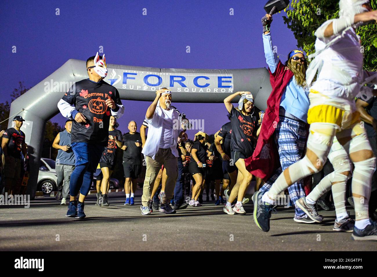 Military members assigned to Incirlik Air Base, Turkey, run during a 5k ...
