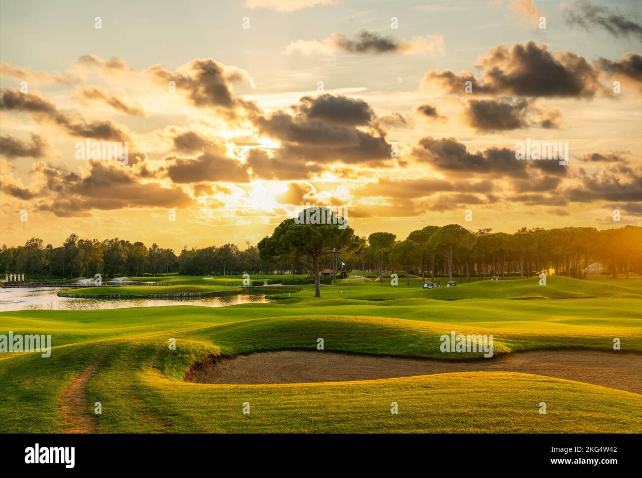 Panorama Golf course with a sand bunker in the center. Dramatic clouds ...