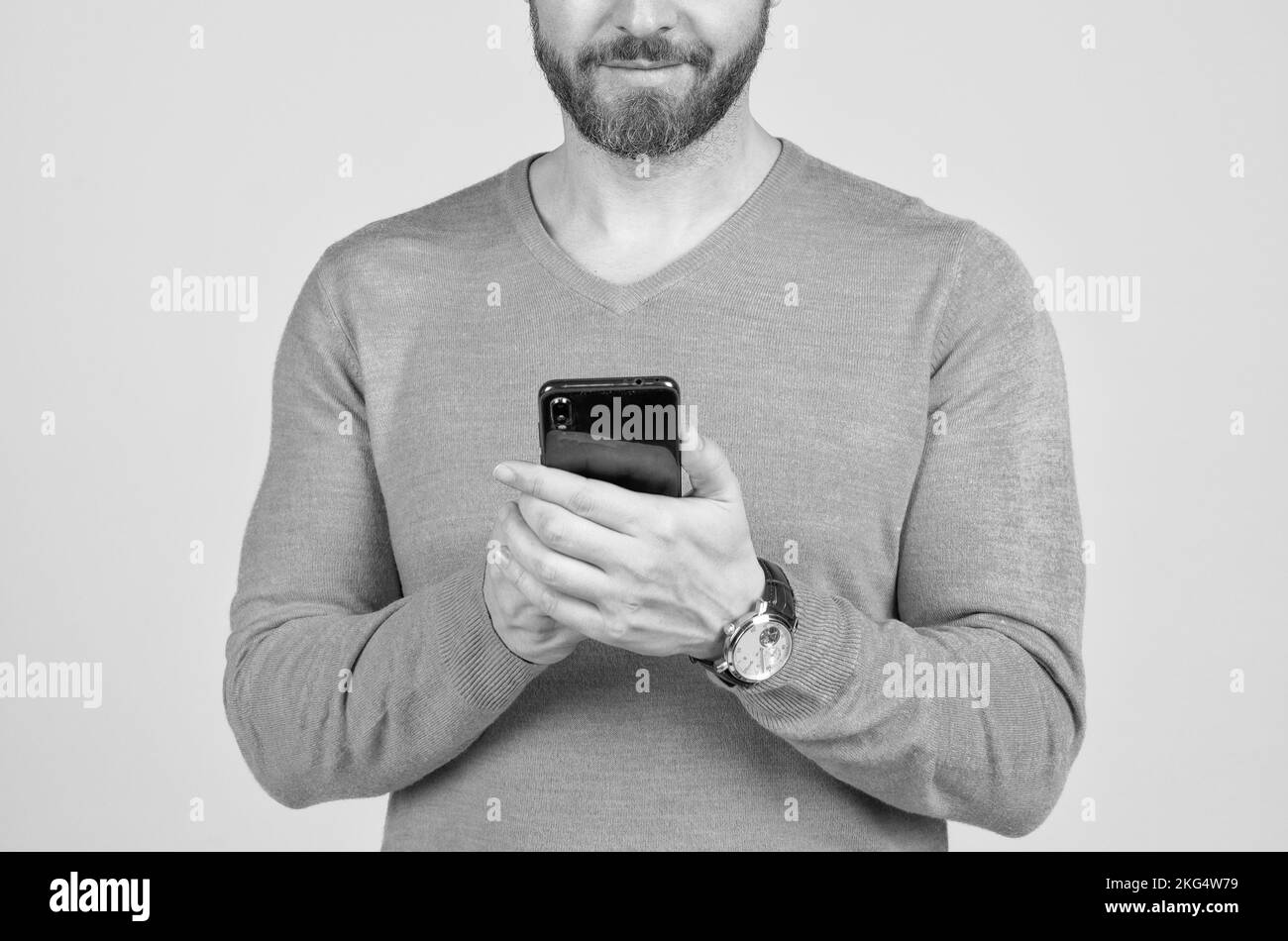 cropped man with beard chatting online on smartphone, communication ...