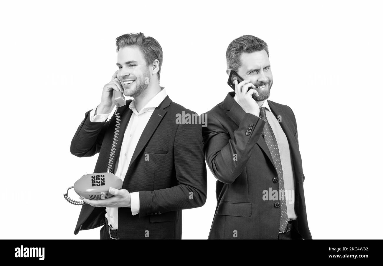 Happy managers talk on mobile phone and telephone isolated on whiite ...