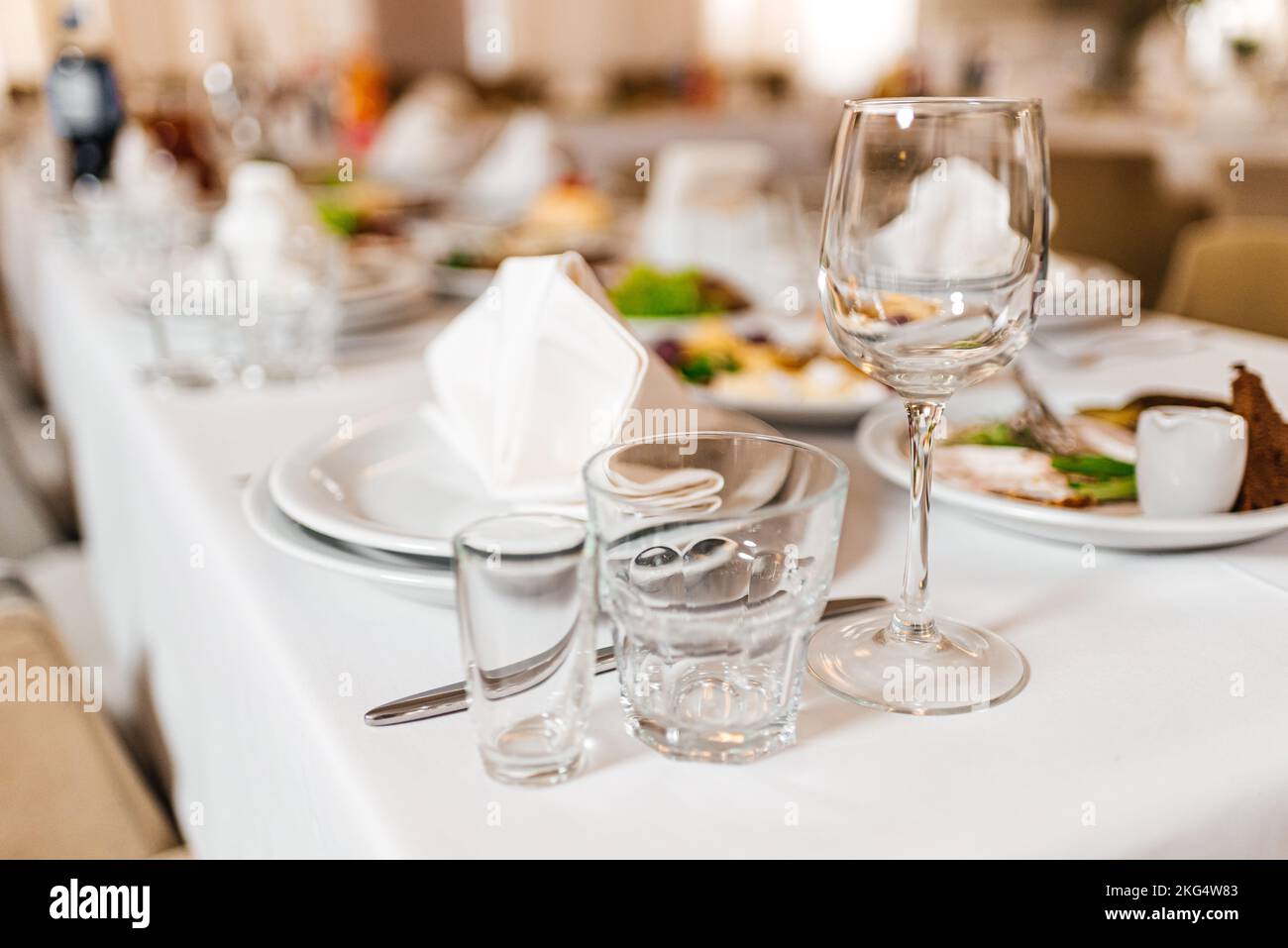 elegant dinner table setting in restaurant or hotel with wine glasses Stock Photo - Alamy