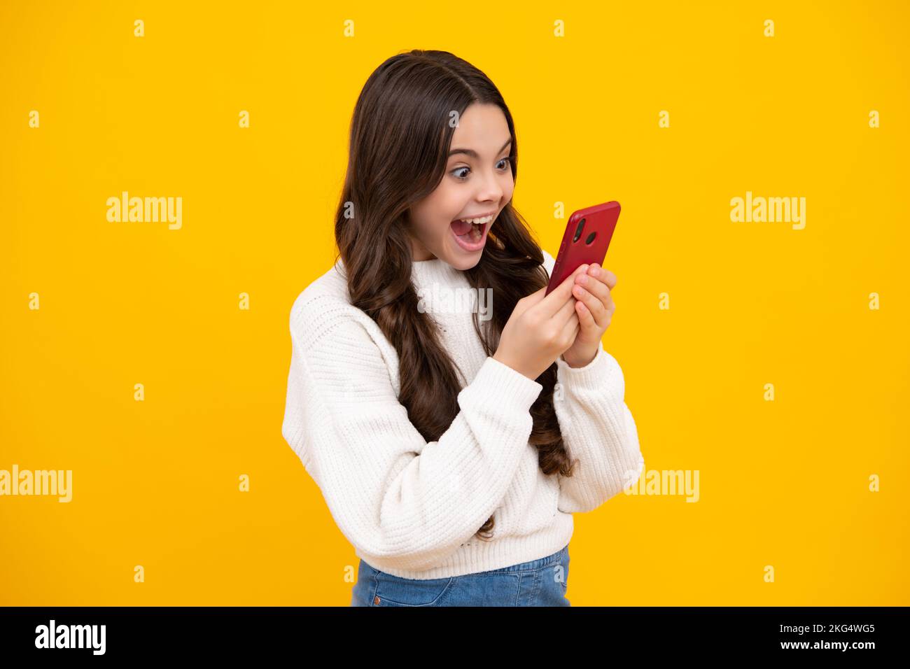 Mobile online shopping. Cute teen child girl paying with phone, texting ...