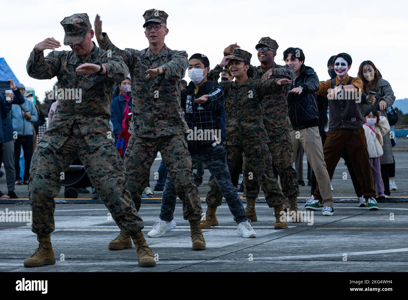 U.S. Marines with III Marine Expeditionary Force Band dance with ...