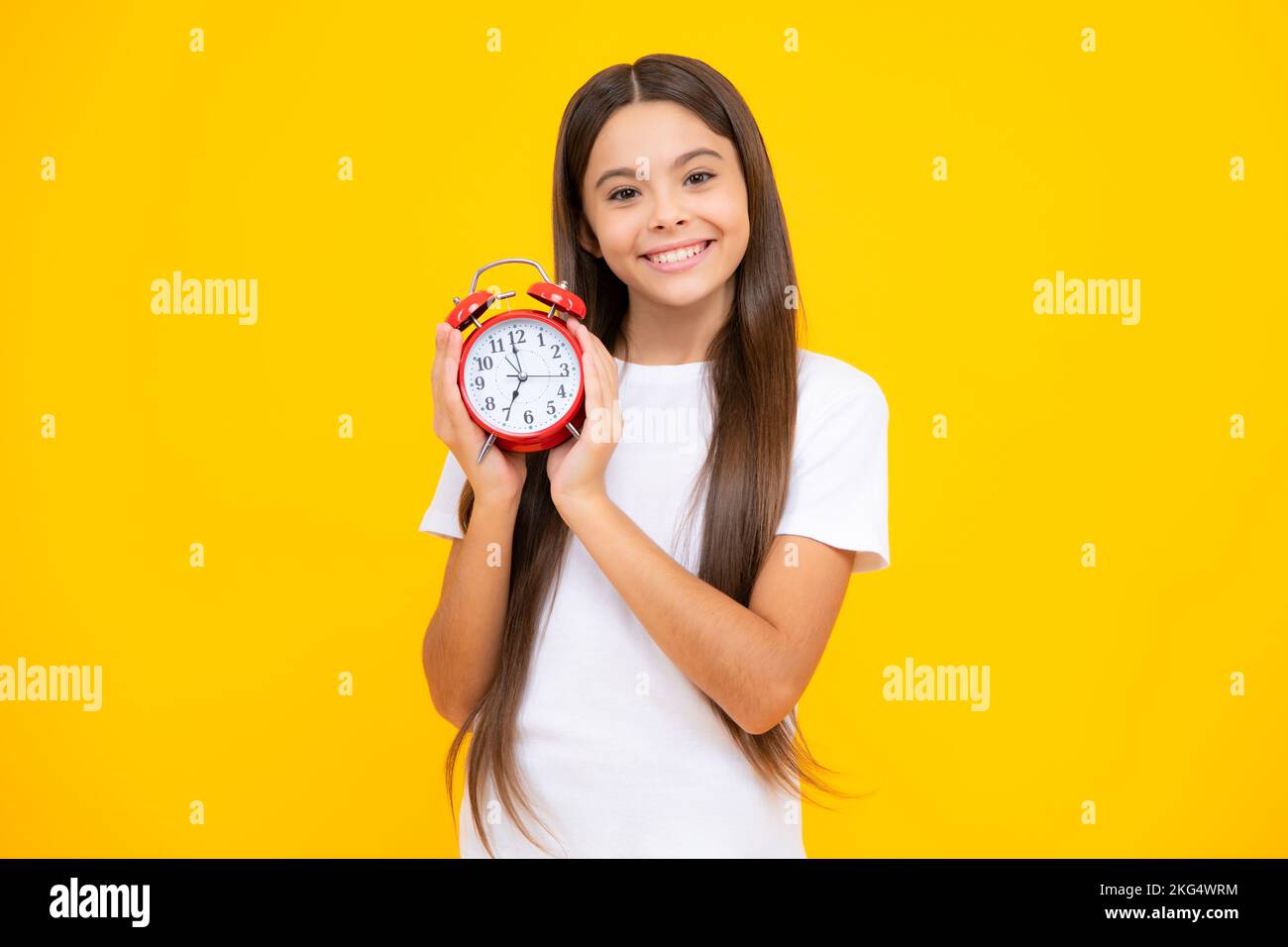 Happy teenager portrait. Teen girl 12, 13, 14 years old look at alarm ...