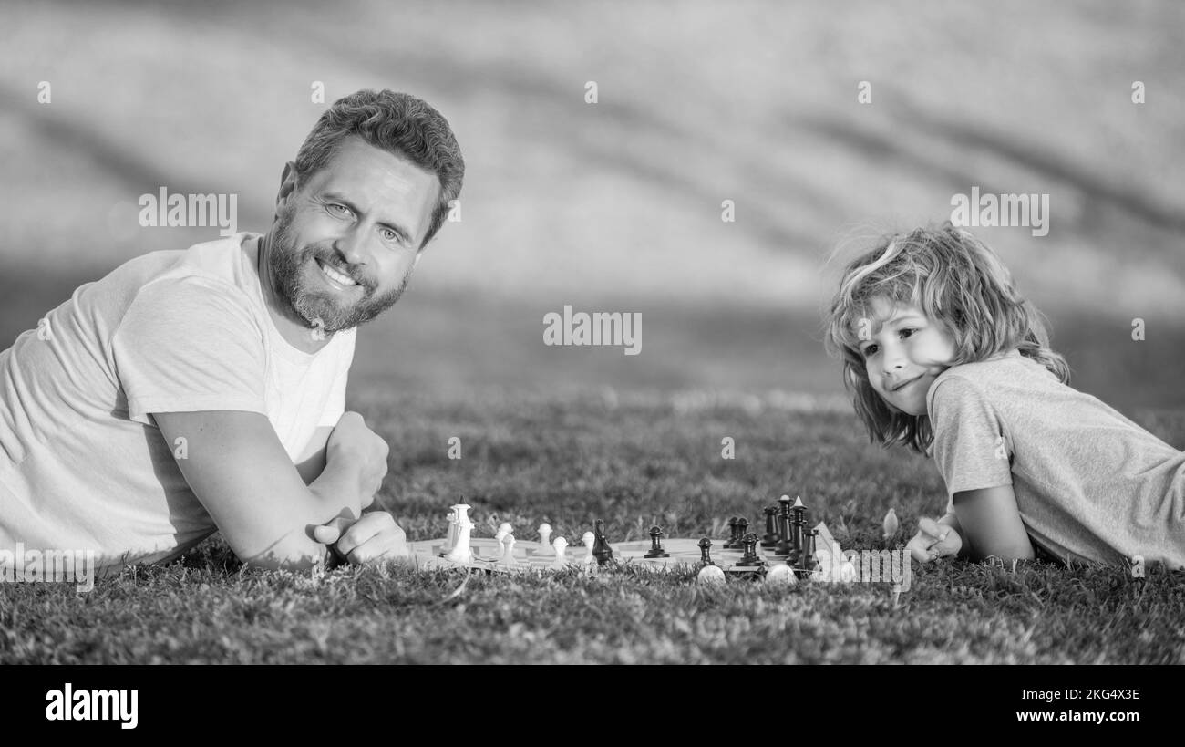 strategic and tactic. tutorship. dad and kid play logic game. father ...