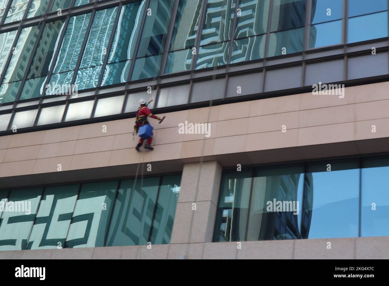 Window Cleaners cleaninf=g in DIFC DUbai UAE Stock Photo - Alamy