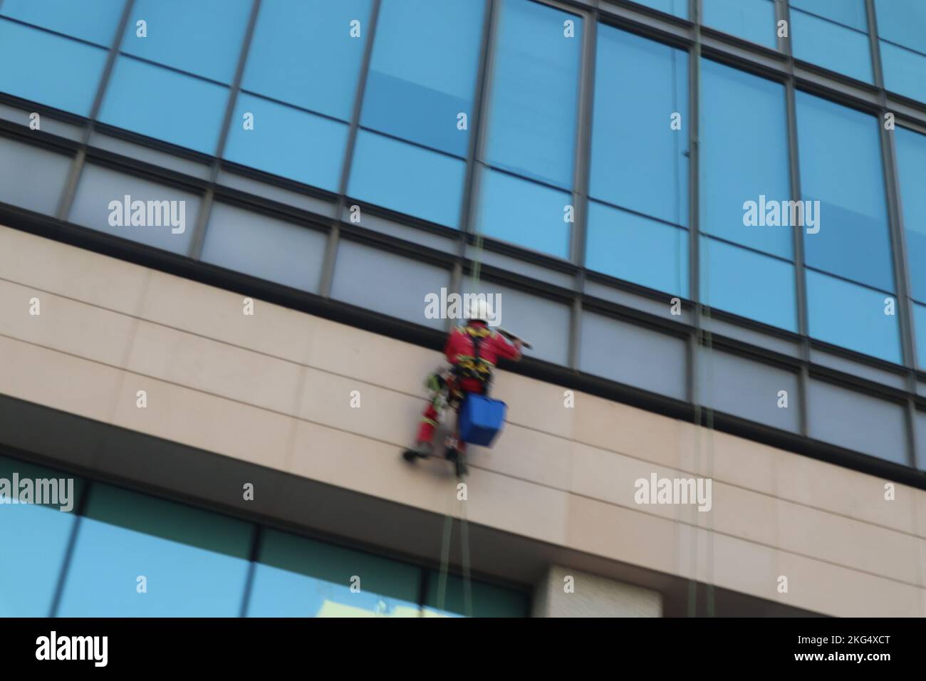Window Cleaners cleaninf=g in DIFC DUbai UAE Stock Photo - Alamy