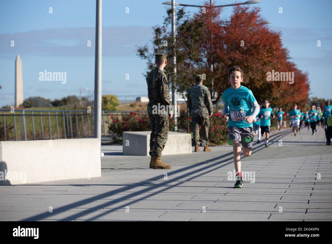 Kids race to the finish during the Marine Corps Marathon Kids Run in ...