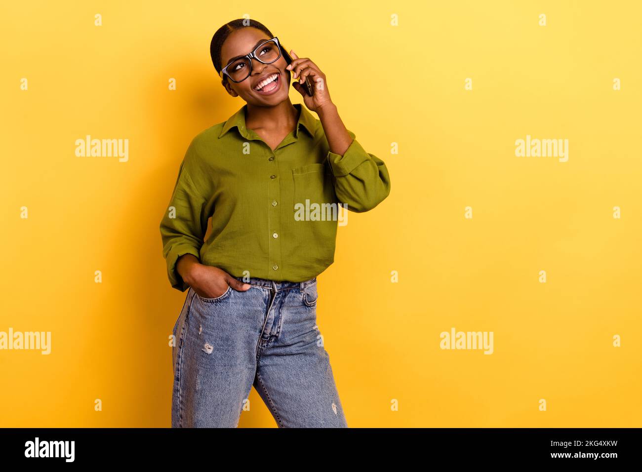 Portrait of attractive cheerful girl using gadget calling friend ...