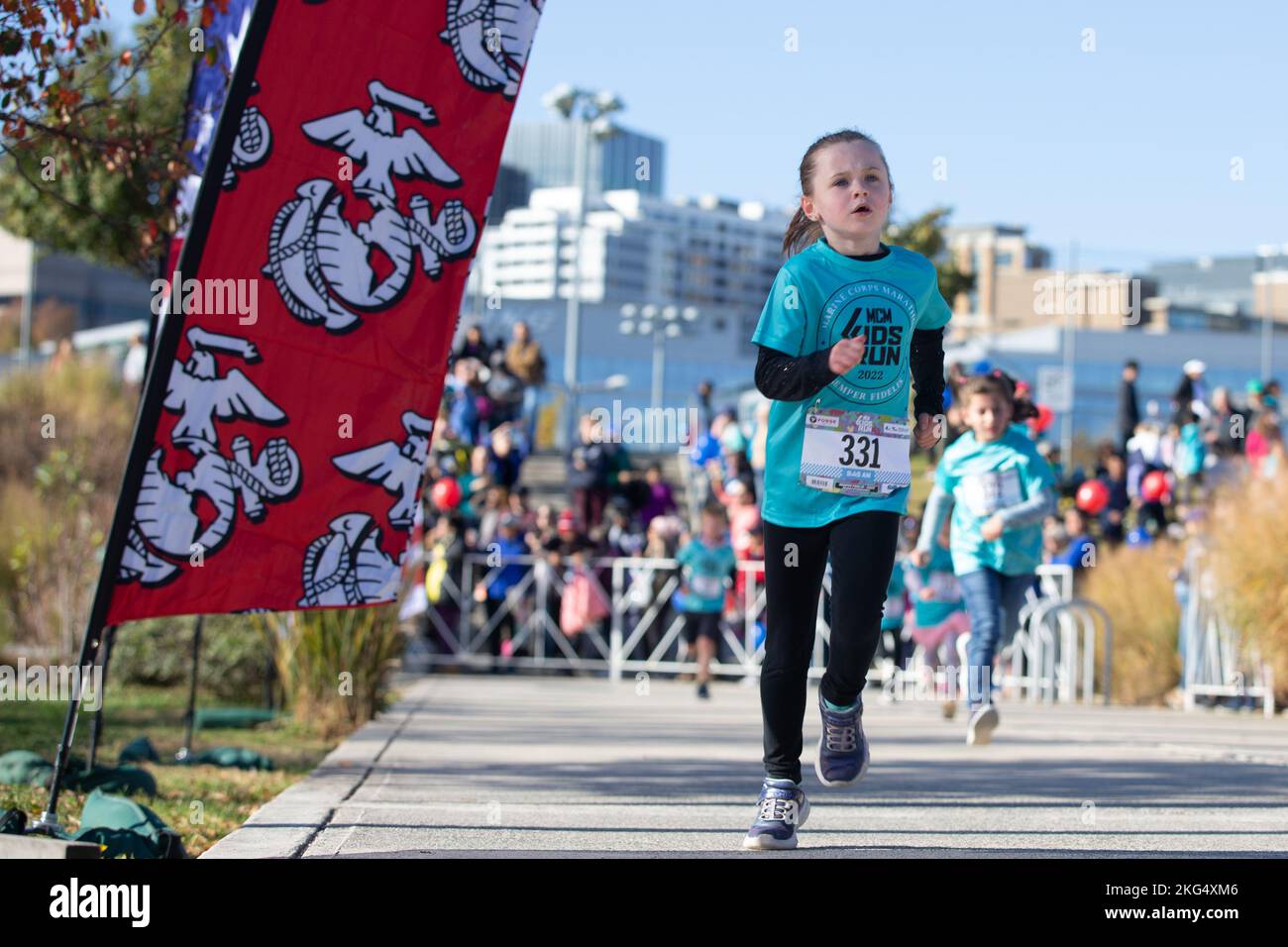 Kids race to the finish during the Marine Corps Marathon Kids Run in ...