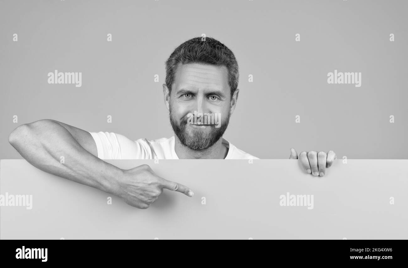 presenting novelty information. male behind yellow paper. for your ...