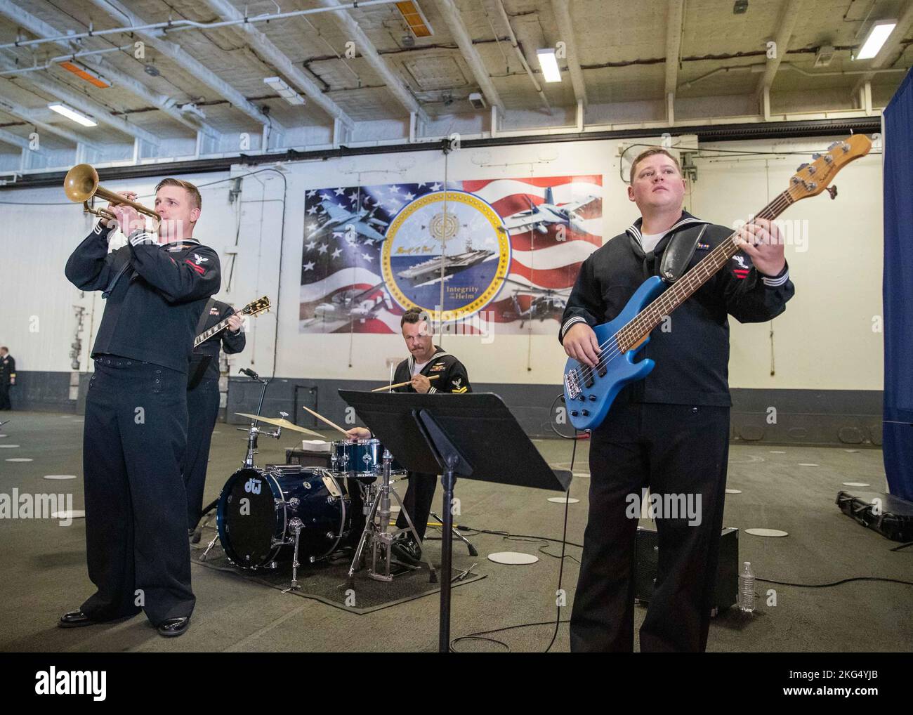 The U.S. Navy Band performs in the hangar bay of the first-in-class ...
