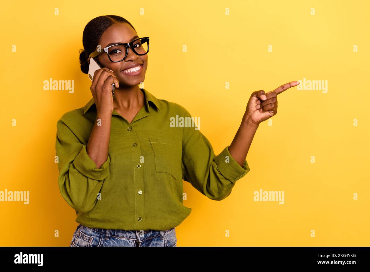 Portrait of beautiful trendy cheerful girl calling friend talking ...