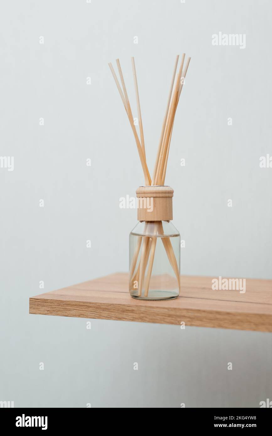 Reed air freshener on table in room home Stock Photo - Alamy
