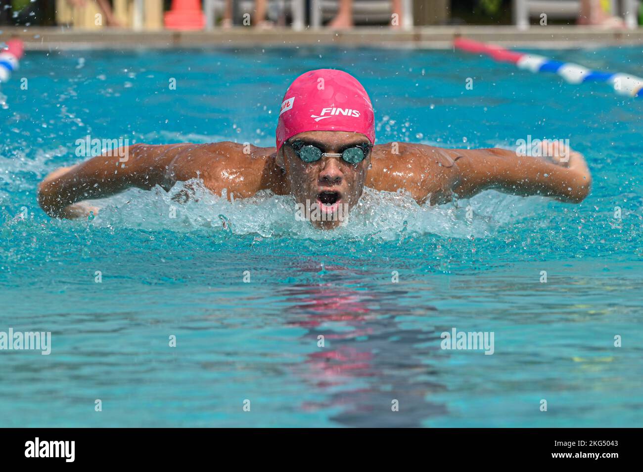 A swimmer swims butterfly during a Guam Swimming Federation swim meet ...