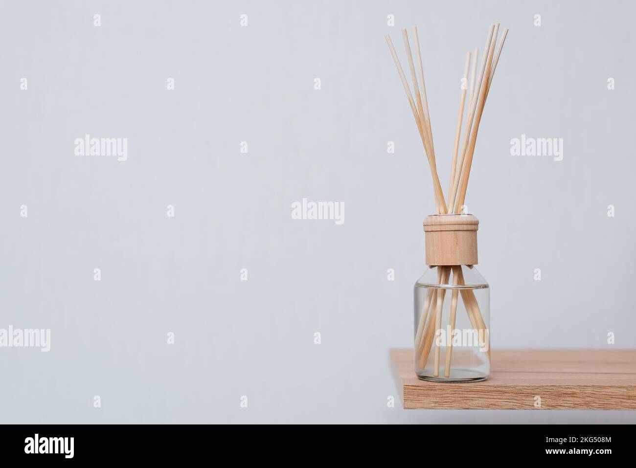 Aroma sticks in glass bottle. Wooden aroma sticks in a glass flask ...