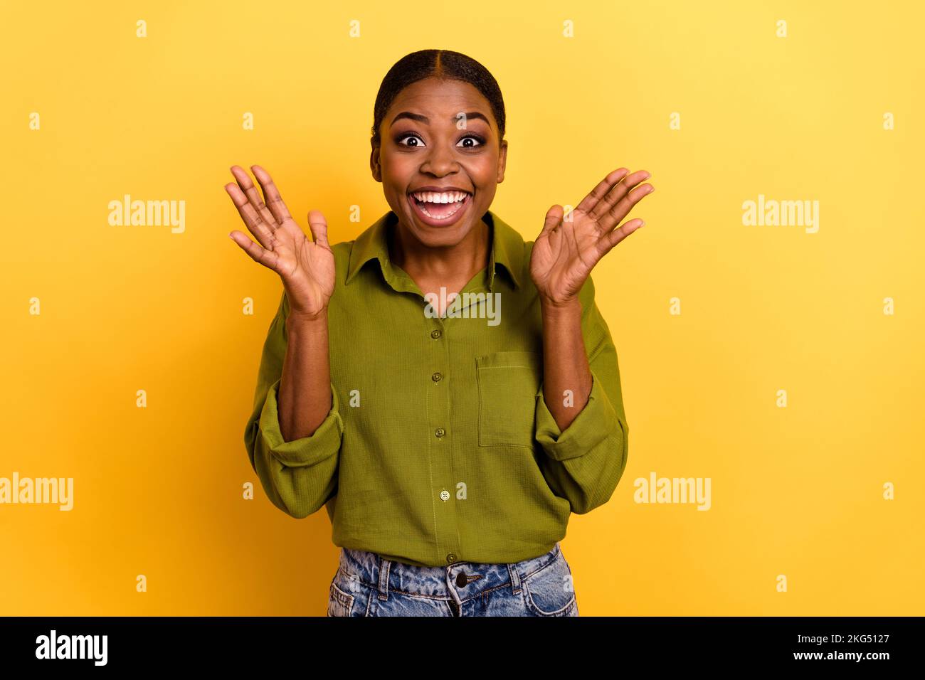 Portrait of attractive cheerful amazed brunette girl applauding ...