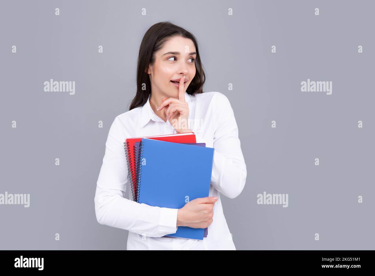 Charming student isolated on gray background. Woman high school student ...