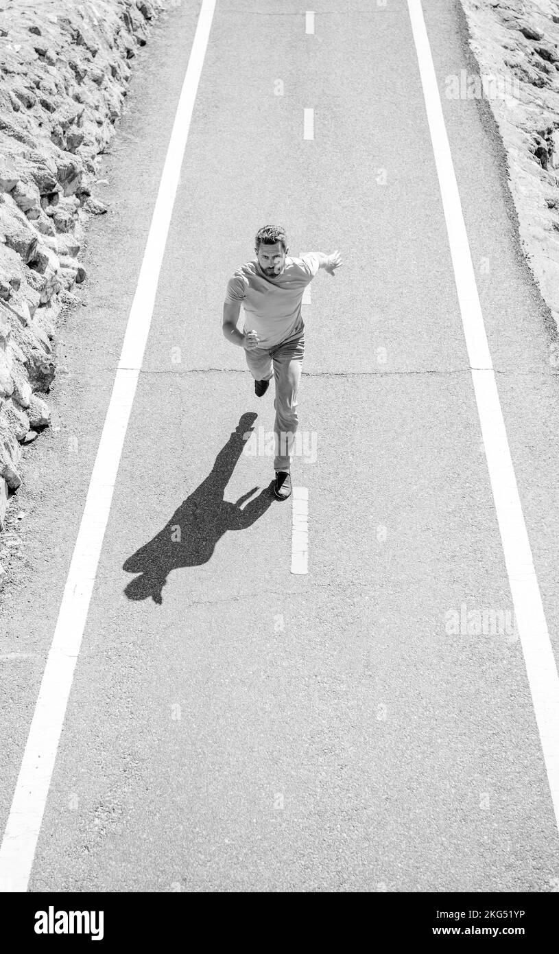 mature man running on road. sport activity. full of energy. guy feel ...