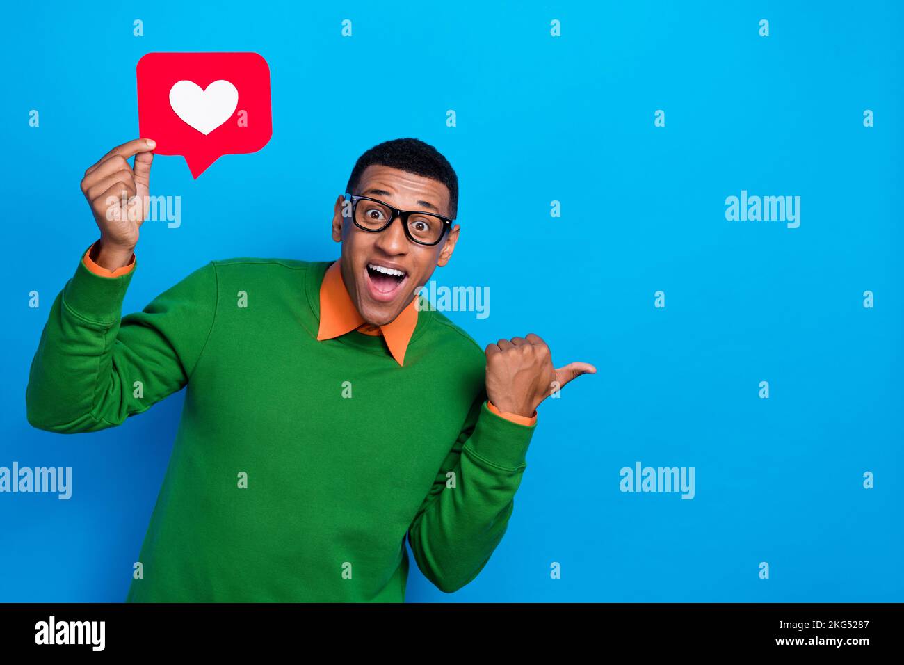 Portrait photo of young excited man wear glasses surprised finger ...