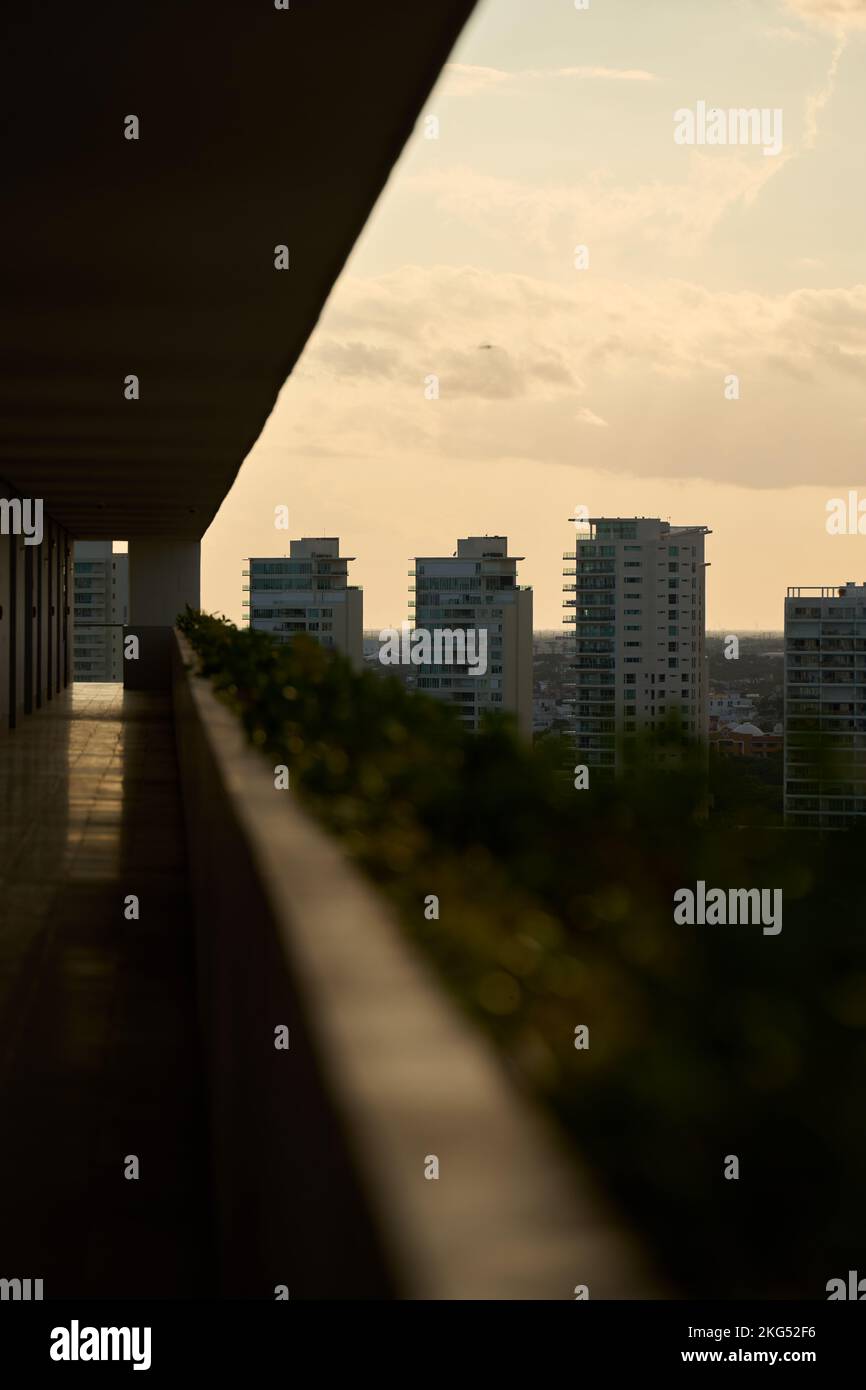 A vertical shot of Cancun city buildings taken from a balcony, Mexico ...