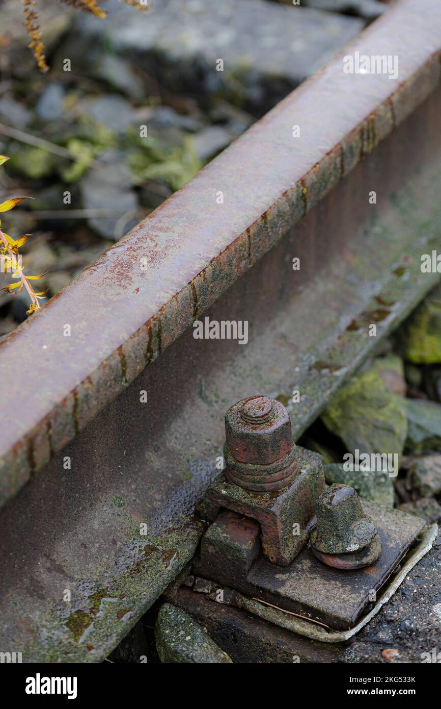 A closeup shot of a part of a rusted train track Stock Photo - Alamy