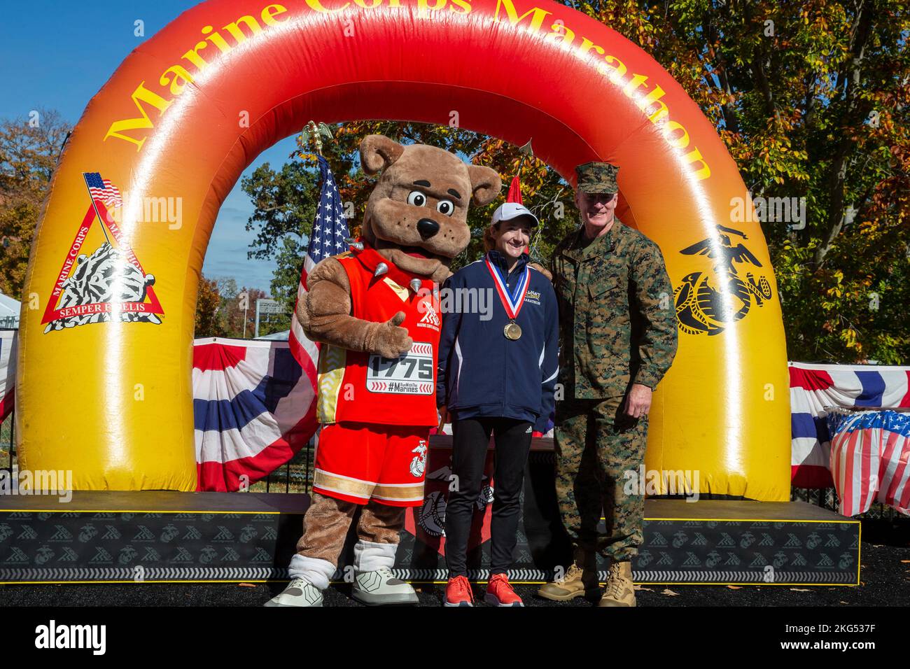 U.S. Navy Lieutenant, Rachel Viger poses with her medal and secures the ...