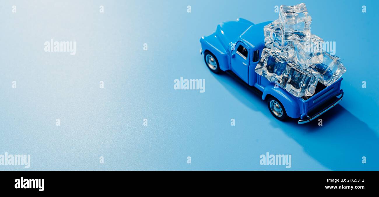 The car is loaded with ice cubes. Toy car minimalism Stock Photo - Alamy