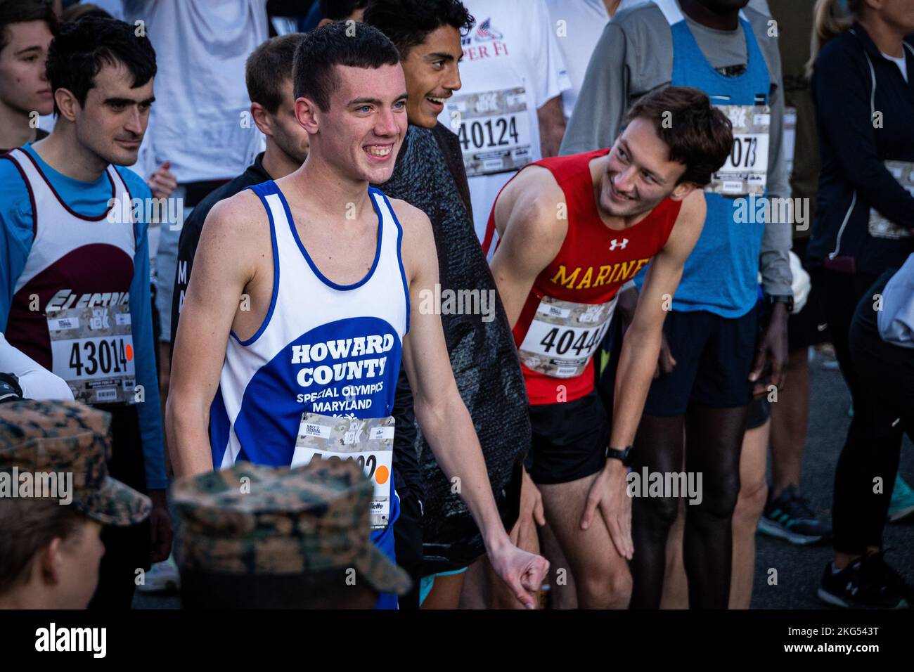 Runners prepare to take off from the start line of the Marine Corps ...