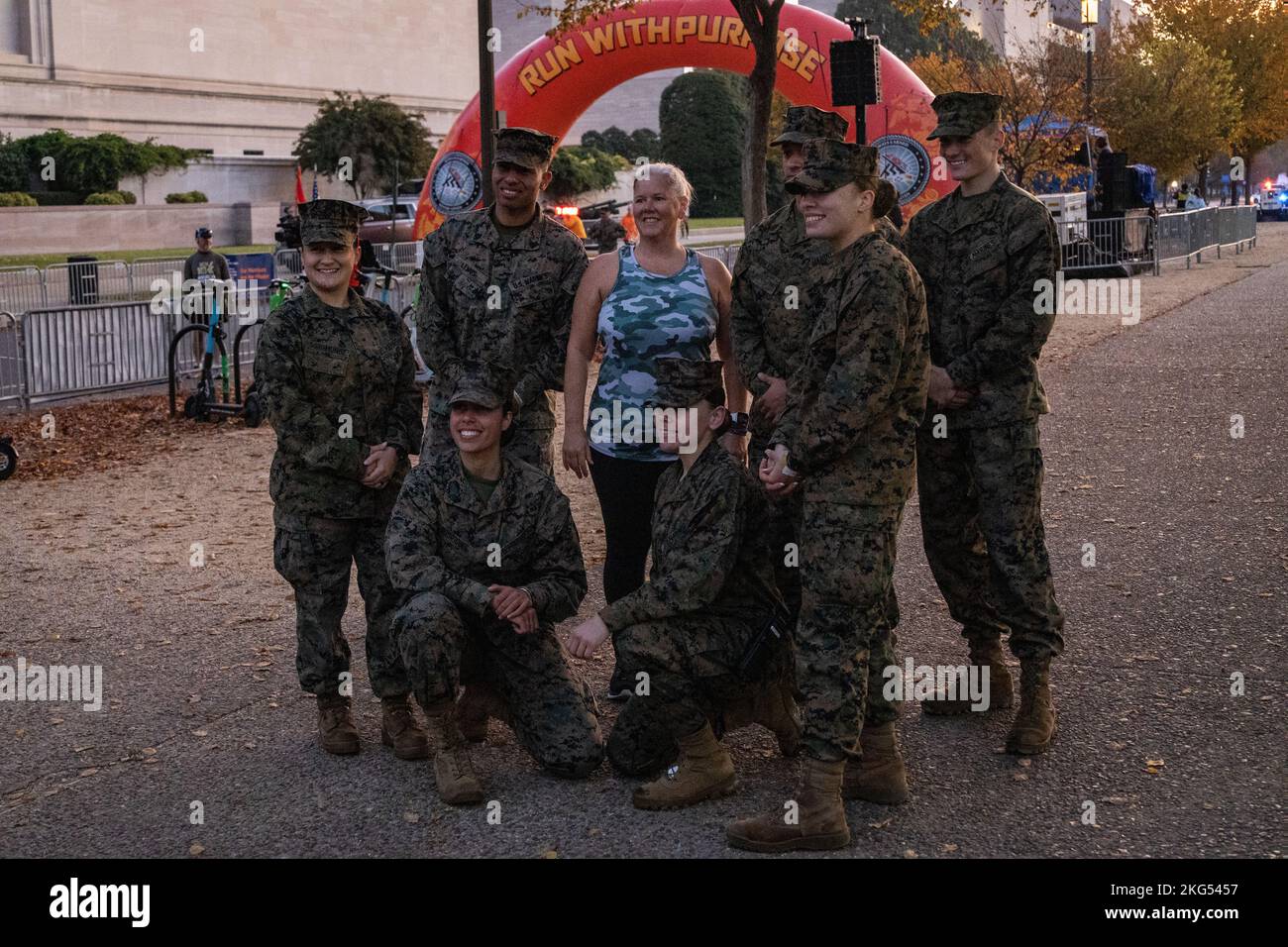 Race participants take photos with U.S. Marines supporting the Marine ...