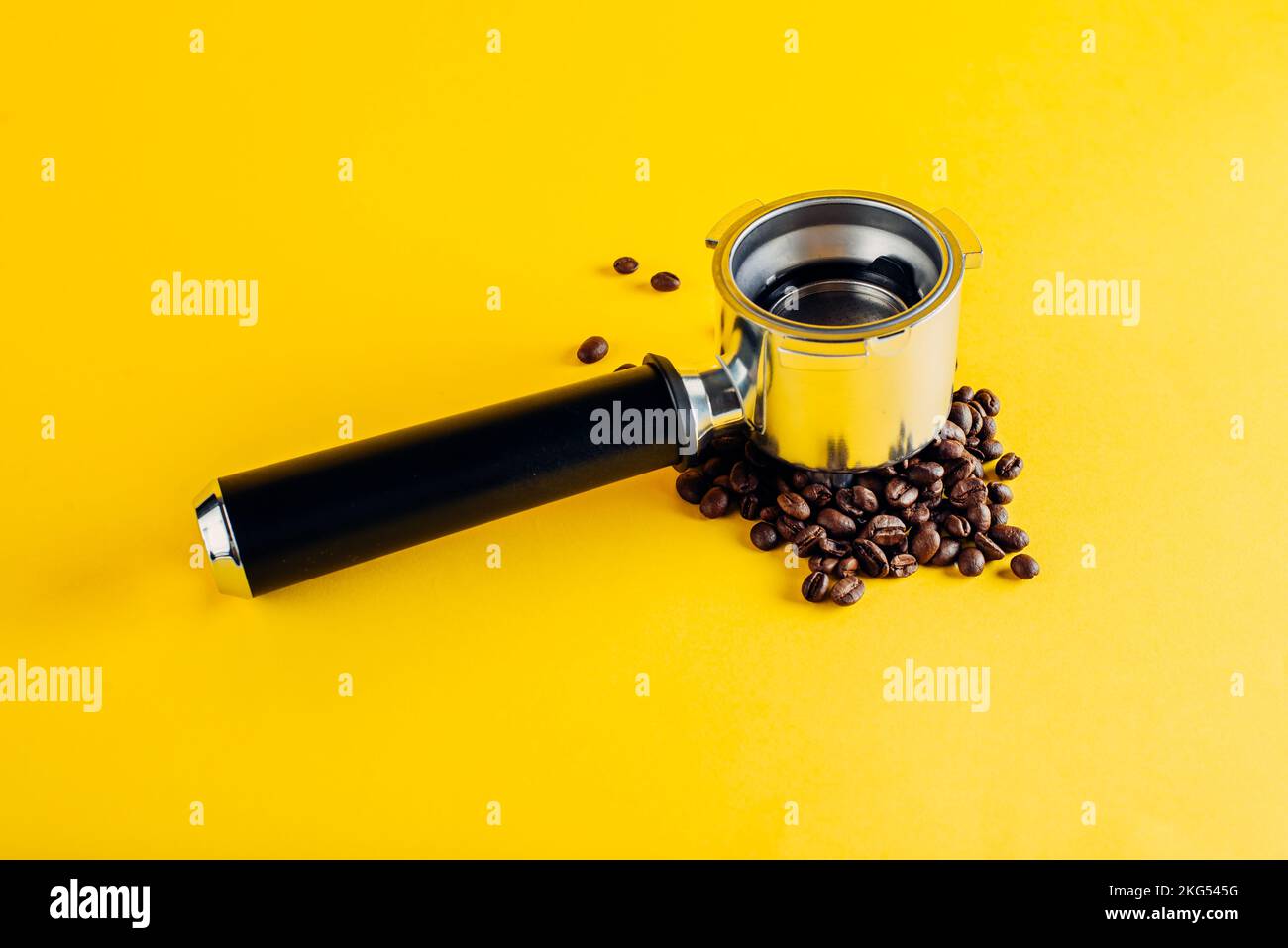 Portafilter on coffee beans. Yellow port background filter Stock Photo ...