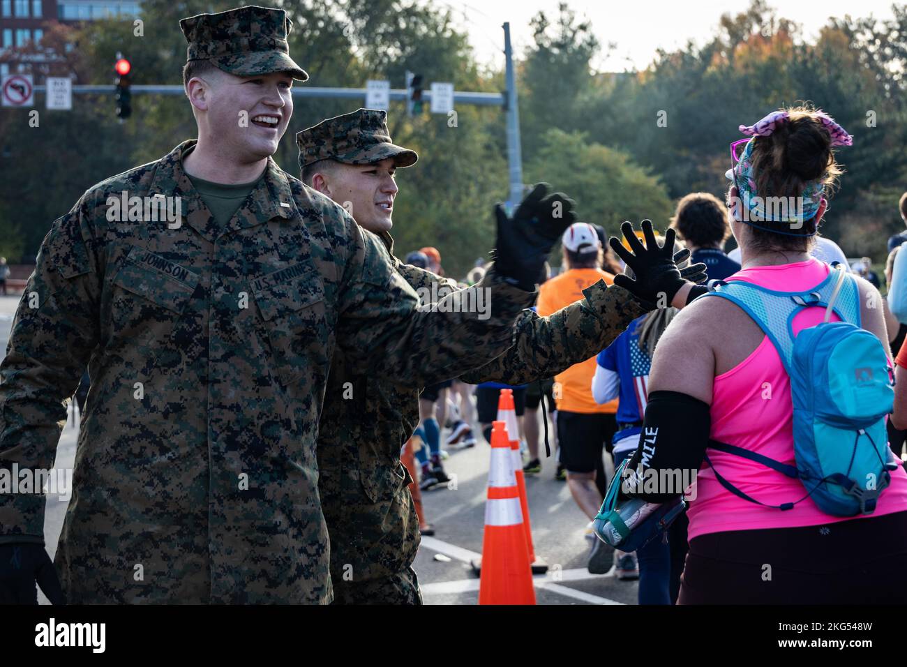 U.S. Marines supporting the 47th Marine Corps Marathon encourage ...