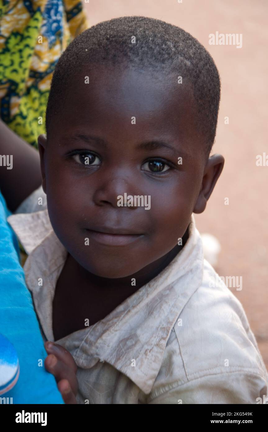 Small boy hiding behind his father, Azove, Couffo, Benin Stock Photo ...