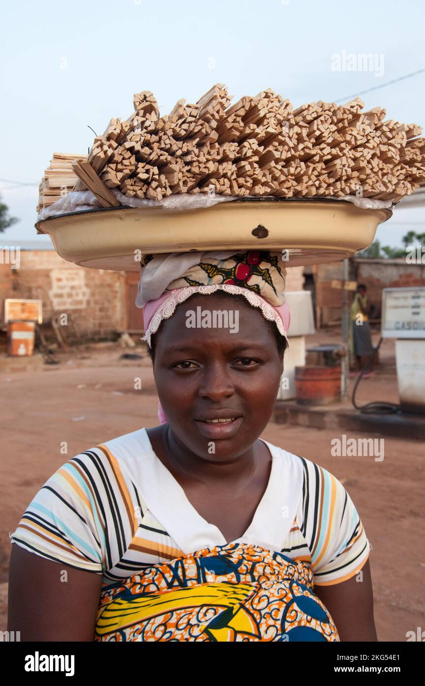 Women selling tooth picks; Azove, Couffo, Benin. The sticks are used to ...
