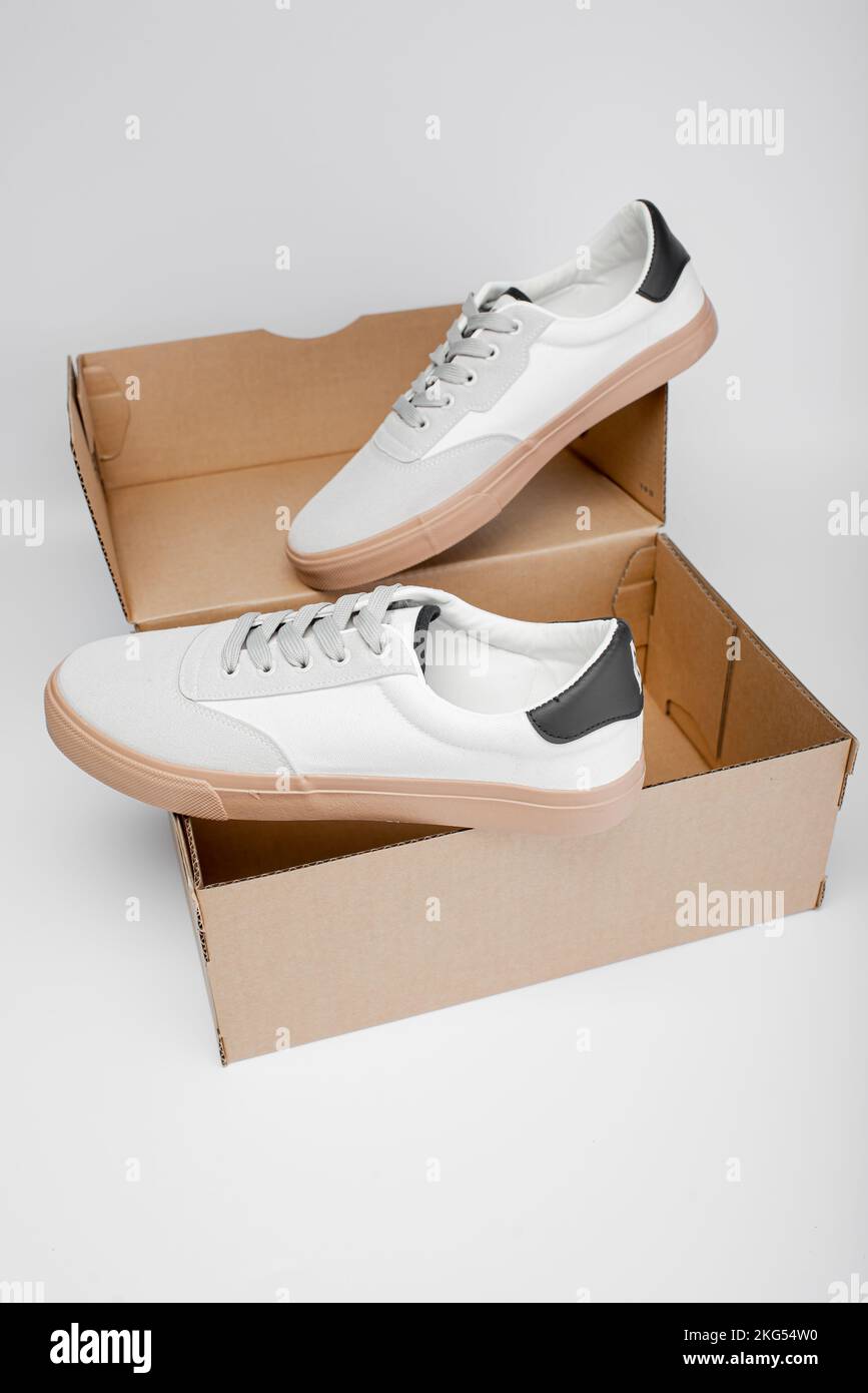 shoes in a cardboard box. Casual white sneakers Stock Photo - Alamy